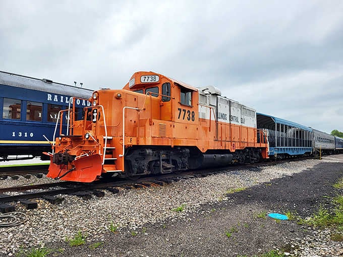 That bold orange engine stands ready like a trusty workhorse, proving not all heroes wear capes or shiny paint.
