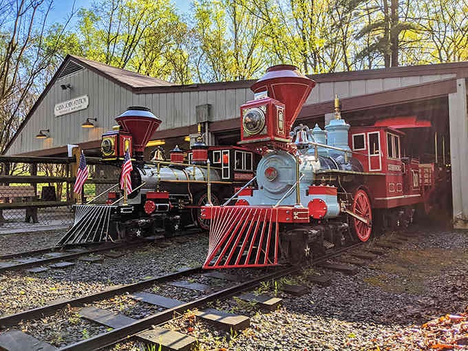 These red vintage engines look like they rolled straight out of a Wild West movie set, complete with patriotic flair.