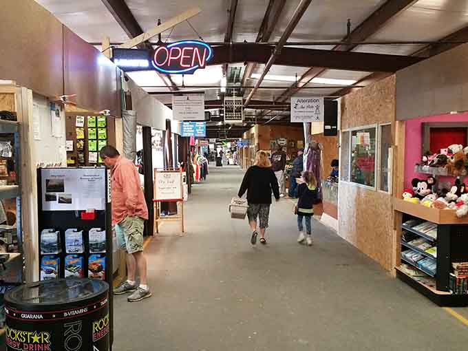 That glowing "OPEN" sign beckons like a lighthouse guiding treasure hunters to endless aisles of discovery.