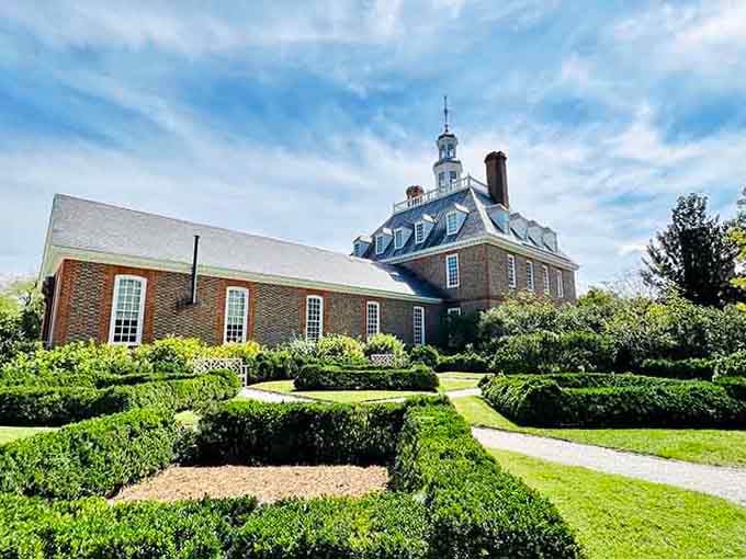 Perfectly manicured hedges frame this colonial mansion like a scene straight from a Jane Austen novel.