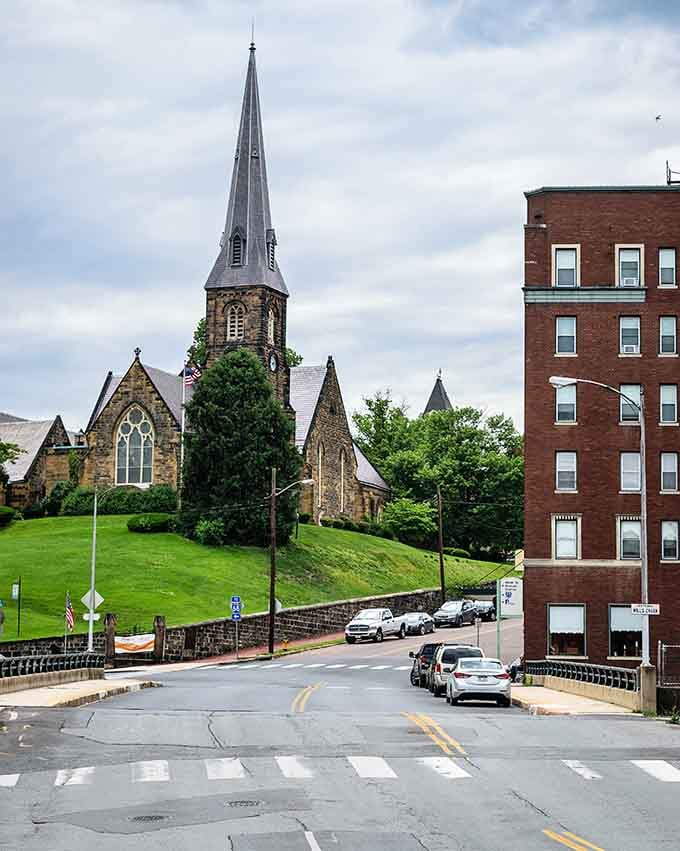 That church steeple reaches skyward like a postcard from simpler times when architecture told stories worth remembering forever.