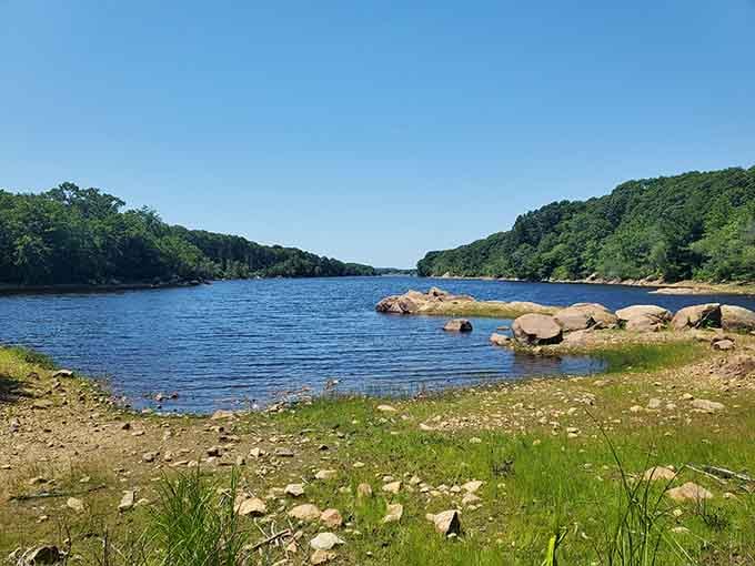 These tranquil waters reflect the surrounding trees like nature's own mirror, peaceful and perfectly unspoiled.
