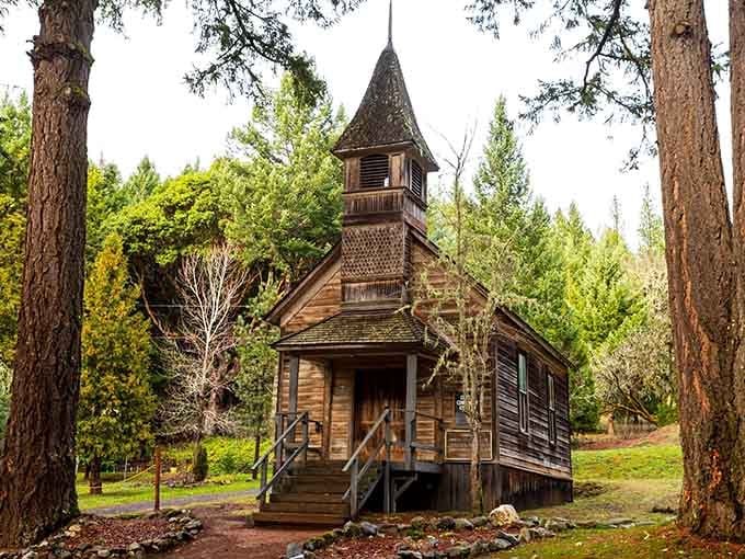 This weathered church steeple rises from the forest like something out of a frontier photograph album.