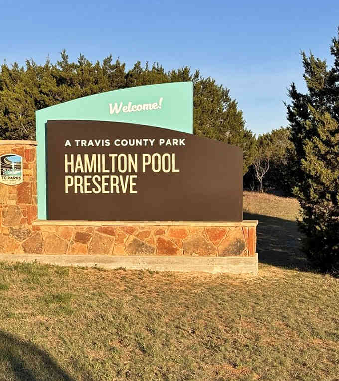 That cheerful welcome sign promises natural wonders that'll make your jaw drop and camera work overtime.