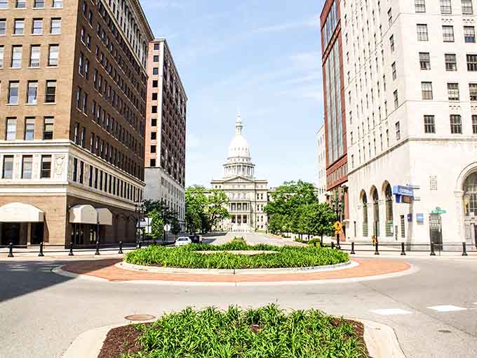 The Capitol dome rises majestically between classic buildings, creating a postcard view that makes you proud to call Michigan home.