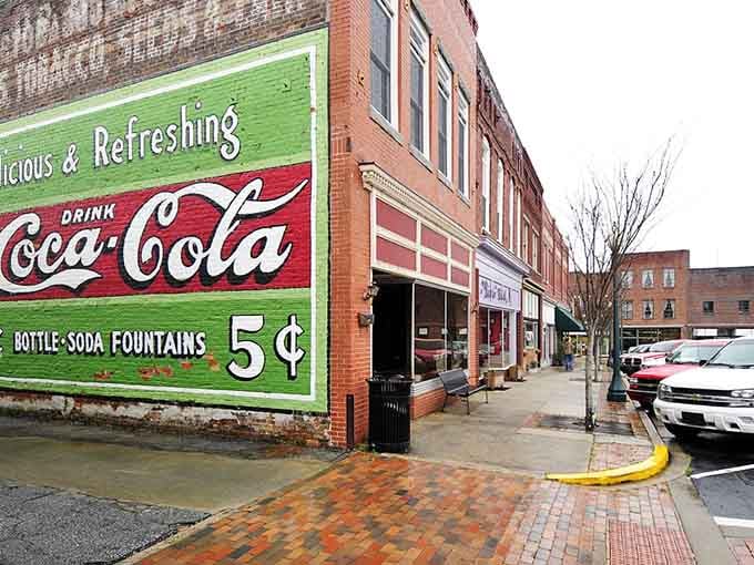 That vintage Coca-Cola sign advertising five-cent sodas is pure nostalgia, reminding us when everything cost less than coffee today.