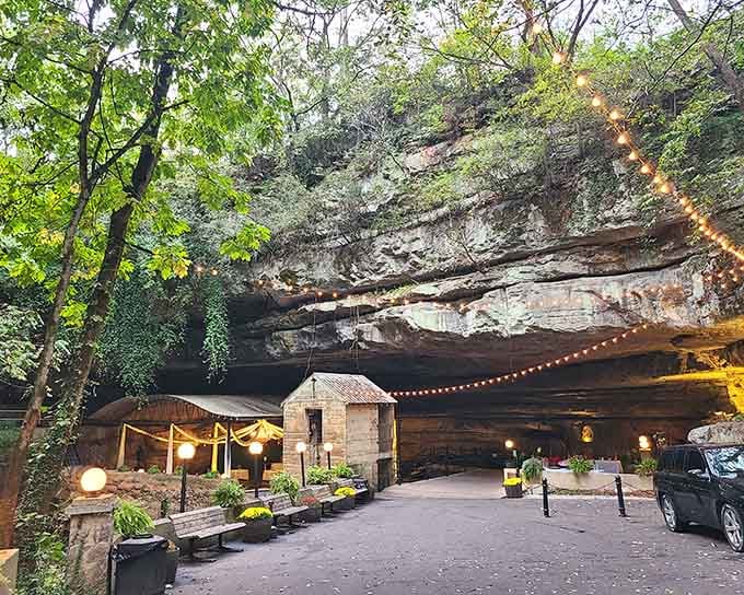 String lights and ancient rock create an enchanting entrance to one of nature's most spectacular underground boat rides.