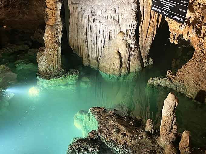 Underground chambers glow with ethereal light, revealing stone formations that look like frozen waterfalls in nature's most spectacular ballroom.