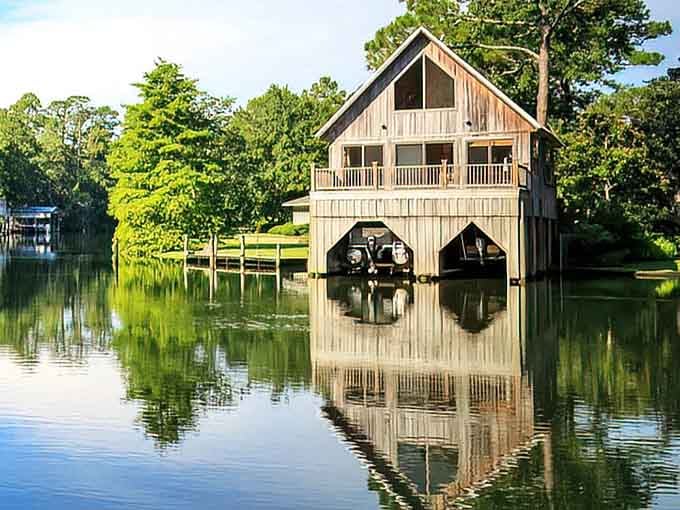 A boathouse floating on mirror-still water looks like something from a dream you'd want to revisit.