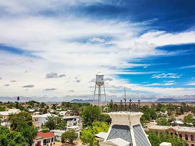 That iconic water tower stands sentinel over a landscape so vast it makes your daily commute seem delightfully insignificant.
