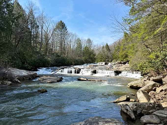 Water rushes over smooth rocks in turquoise ribbons, proving that Mother Nature's still the best landscape architect around.