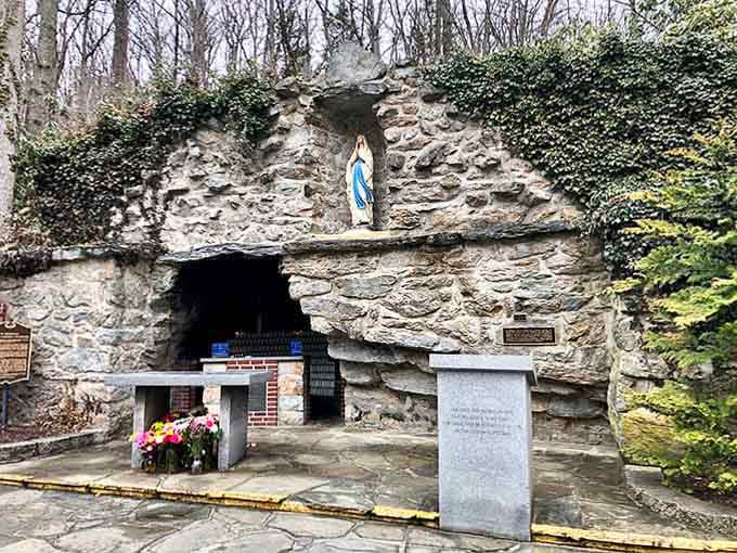 Stone grotto carved into the hillside offers quiet reflection, where faith and nature blend in timeless harmony and peace.