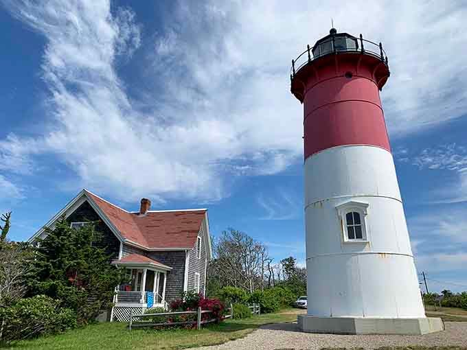 Bold red and white stripes make this Cape Cod sentinel impossible to miss, like a peppermint stick guarding the shore.