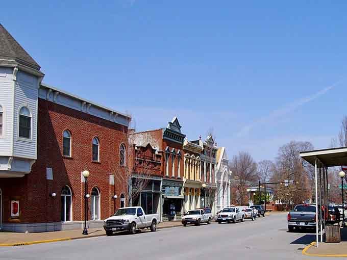Classic architecture meets small-town charm where every storefront window tells its own unique story beautifully.