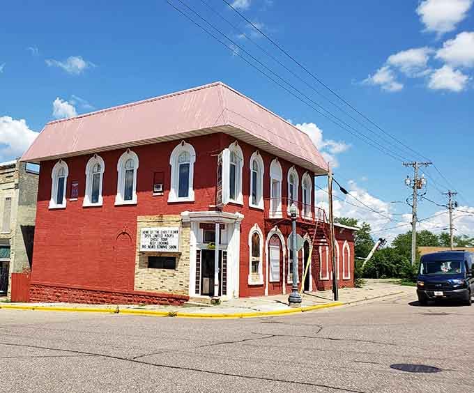 That cheerful red paint can't hide the building's mysterious past&mdash;it's like putting lipstick on a very old, very interesting ghost.