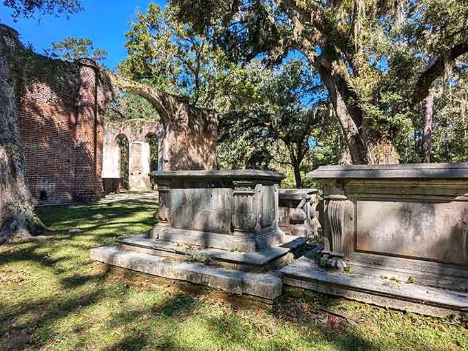 Sunlight filters through ancient oaks onto weathered tombs, creating a scene both peaceful and profoundly moving.