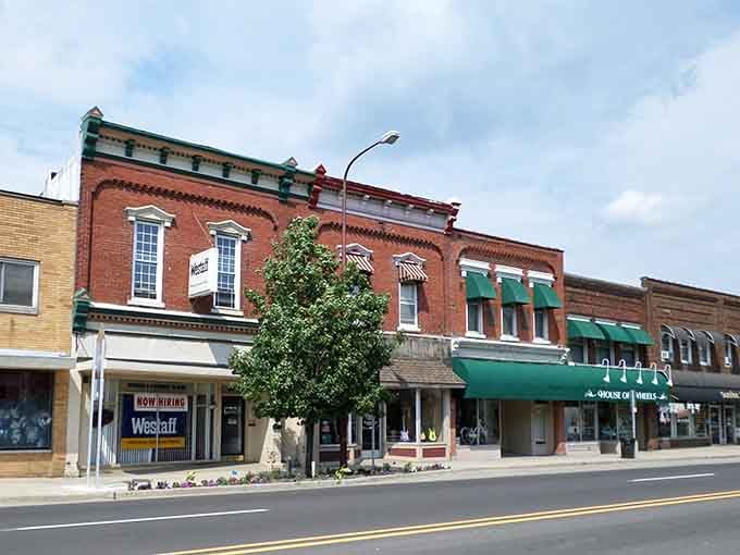 These brick storefronts with their green awnings could be from a Norman Rockwell painting, minus the hefty price tag.
