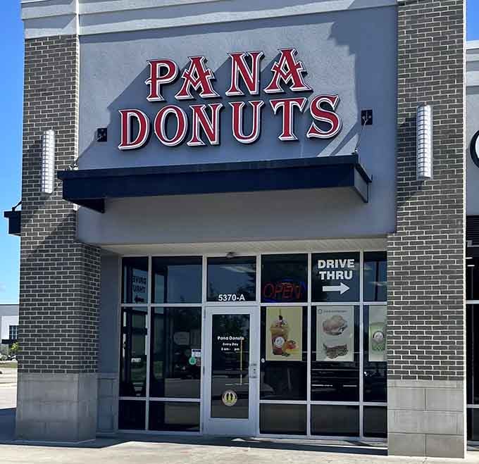 That striking marquee stands proud against blue sky, promising drive-thru convenience without sacrificing old-fashioned quality and taste.
