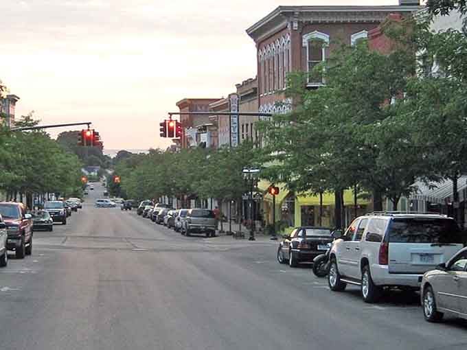 Victorian brick buildings line streets where history whispers from every carefully preserved storefront and lamppost along the way.