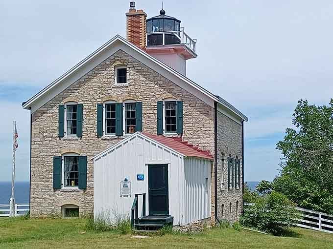 The cream-colored stone walls and green shutters give this beauty the charm of a European countryside cottage with a view.