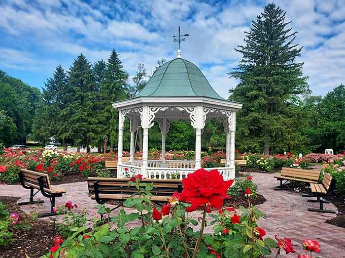 This Victorian gazebo surrounded by crimson roses could make even the Gilded Age jealous of its romantic charm.