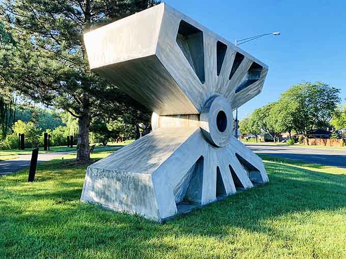 Bold geometric shapes in weathered concrete create dramatic shadows that shift throughout the day like a sundial.
