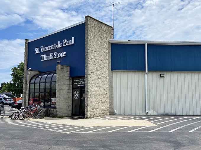 The bold blue exterior and stone accents give this thrift store an unexpectedly sophisticated, almost gallery-like presence.