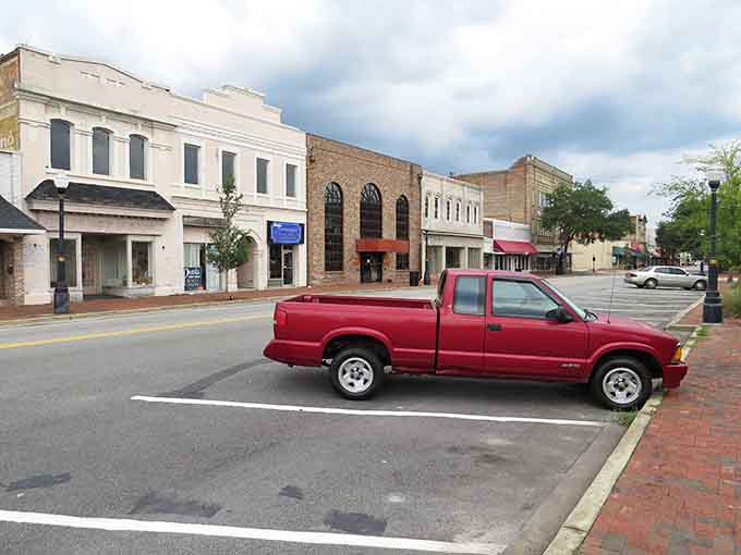 Brick sidewalks and vintage storefronts create a scene straight from Andy Griffith's Mayberry, minus the black-and-white filter.