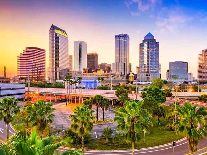 Palm trees frame a skyline that glows like a postcard at golden hour—Tampa knows how to dress up for dinner.