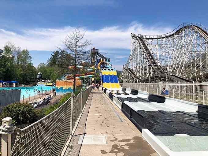 The colorful water slides and the classic coaster backdrop promise a day of thrills and unforgettable memories!