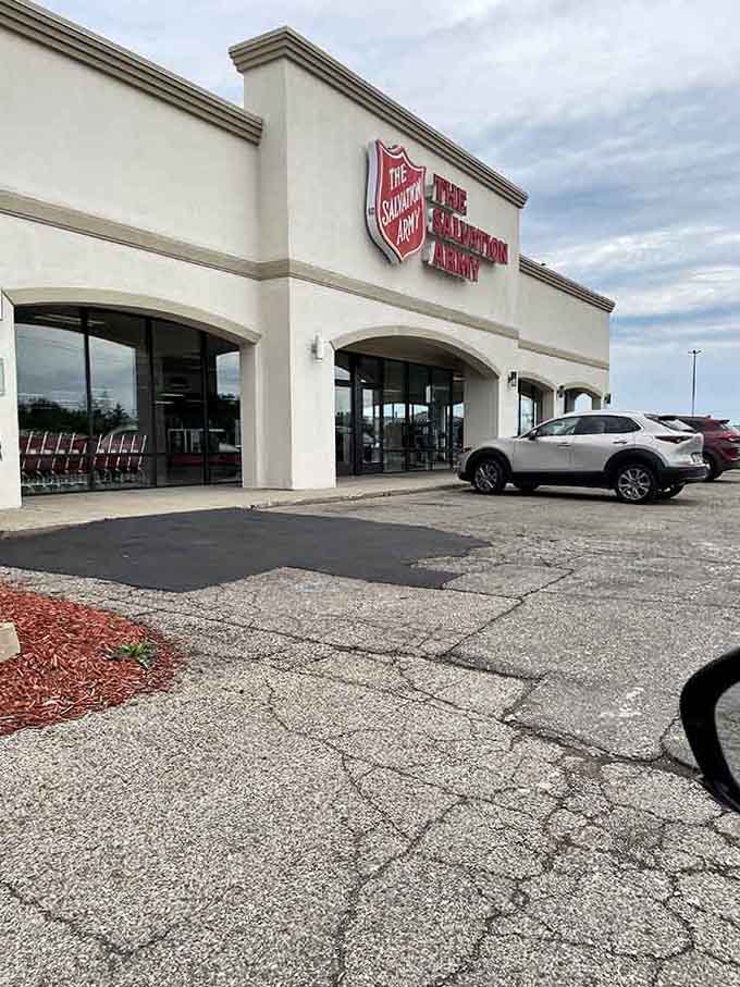 The classic cream facade and arched entryways give this charitable shop an inviting, neighborhood-friendly appeal.