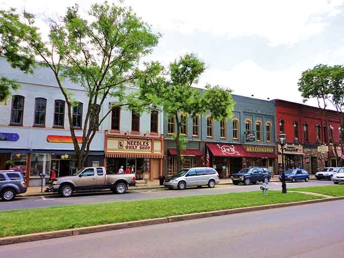 A rainbow of storefronts beneath leafy trees proves small-town charm doesn't need to shout to be heard.