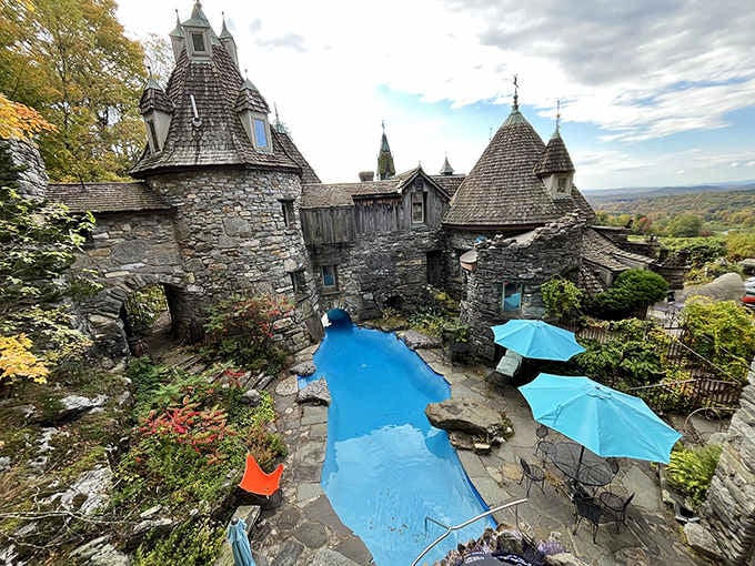 Those blue umbrellas on the terrace suggest someone's living their best fairy-tale life up here in the hills.