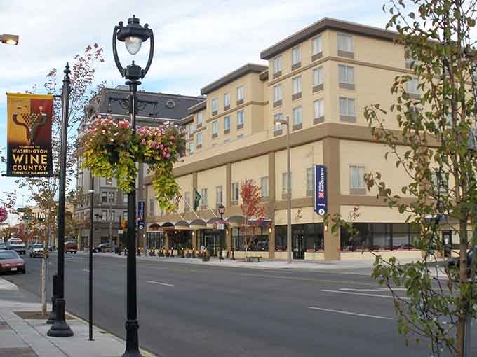 Those hanging flower baskets and vintage lampposts create a scene straight from a postcard you'd actually want to visit.