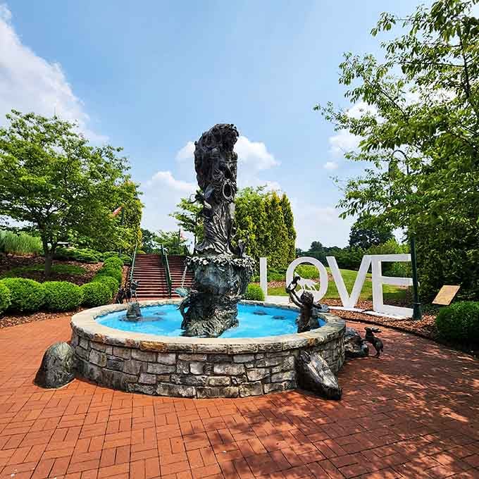 That fountain sculpture and LOVE sign create the perfect spot for photos and sweet small-town moments.