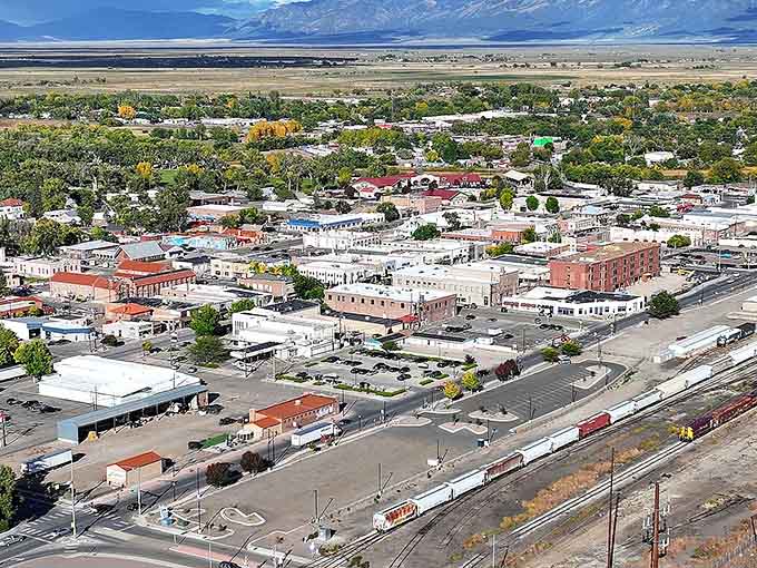 From above, this valley town reveals its grid-like charm, nestled between peaks like a perfectly placed piece in nature's puzzle.