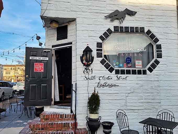 The literary lantern and moody doorway invite you into a world where ravens quote poetry over craft cocktails.