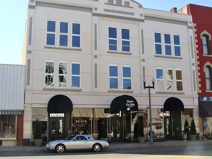 Elegant arched windows on this cream-colored building showcase the architectural pride that built these communities.