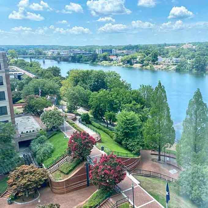 The Flint River curves through lush parkland, offering waterfront views that rival any expensive resort destination.