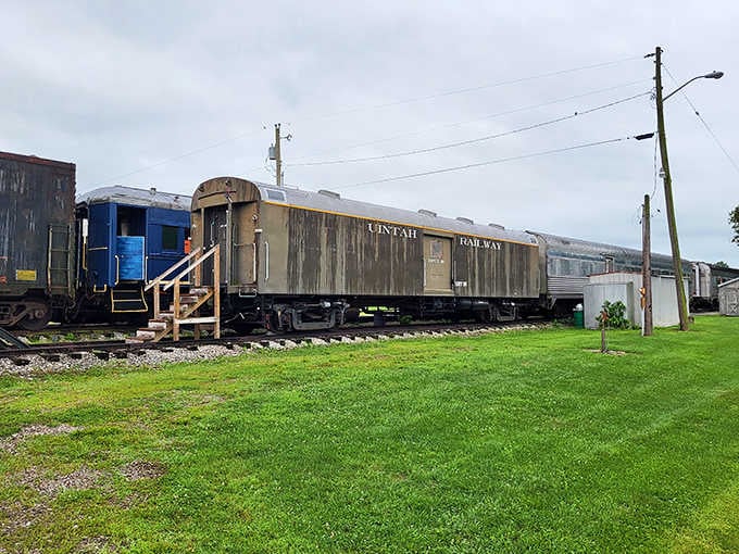 The weathered Pintah Railway car resting on green grass tells stories of countless miles traveled through America's heartland.