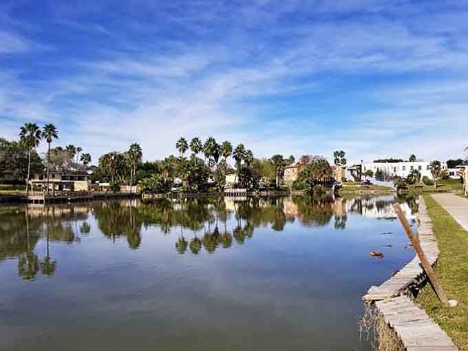 Mirror-smooth waters capture nature's artwork while waterfront paths beckon retirees seeking serenity on a sensible budget.