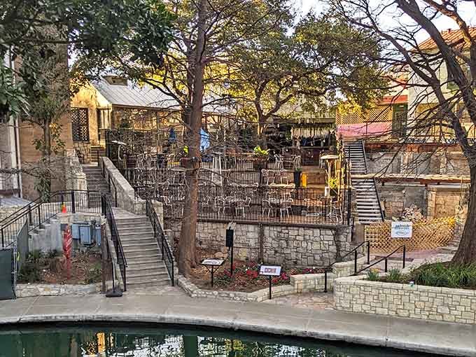 Golden hour transforms this waterside patio into something magical, where conversations flow as smoothly as the river below.