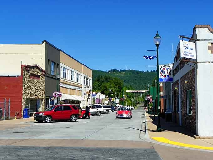 Purple hanging baskets and mountain views create a postcard scene that Mayberry would envy, honestly.