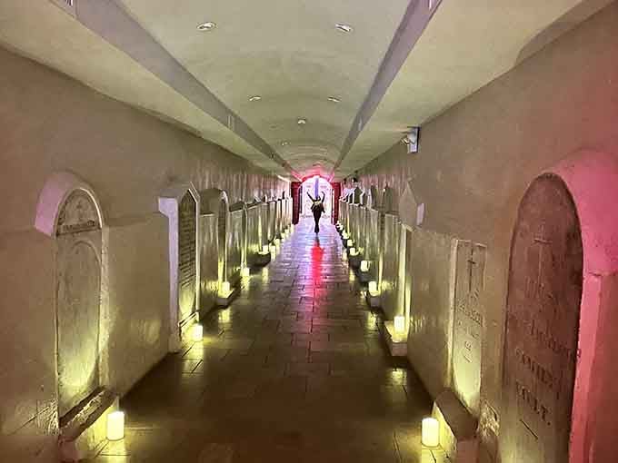 Candlelit passageways lead you through underground burial vaults where history whispers from every stone marker.