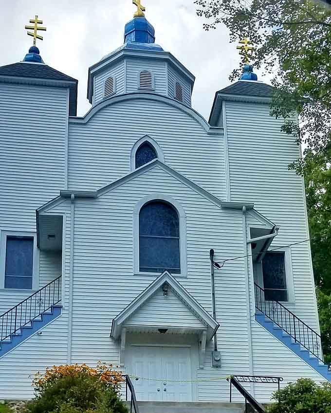 Those brilliant blue domes catch your eye first, then you notice how the white paint whispers tales of bygone congregations.