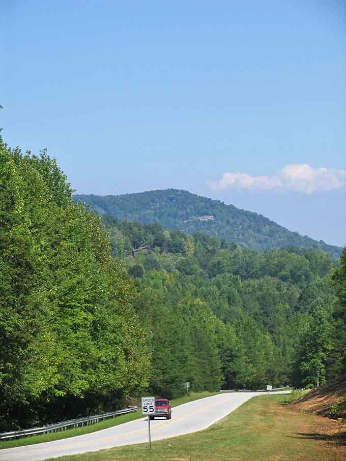 Mountains rise in the distance like a promise, reminding you there's always something bigger worth discovering.