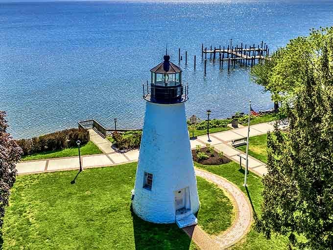 The aerial view reveals how this tower commands the shoreline like a general surveying peaceful territory below.