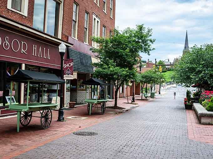 Brick storefronts and shaded walkways create the perfect setting for leisurely strolls where window shopping becomes an actual activity.