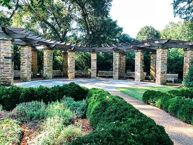 The pergola's classical columns create shaded spots that feel more European garden than neighborhood park, and we're here for it.