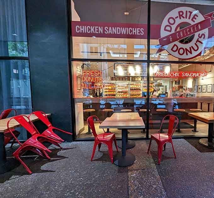 Those bright red chairs practically beg you to sit, people-watch, and enjoy the sweet life one glazed donut at a time.